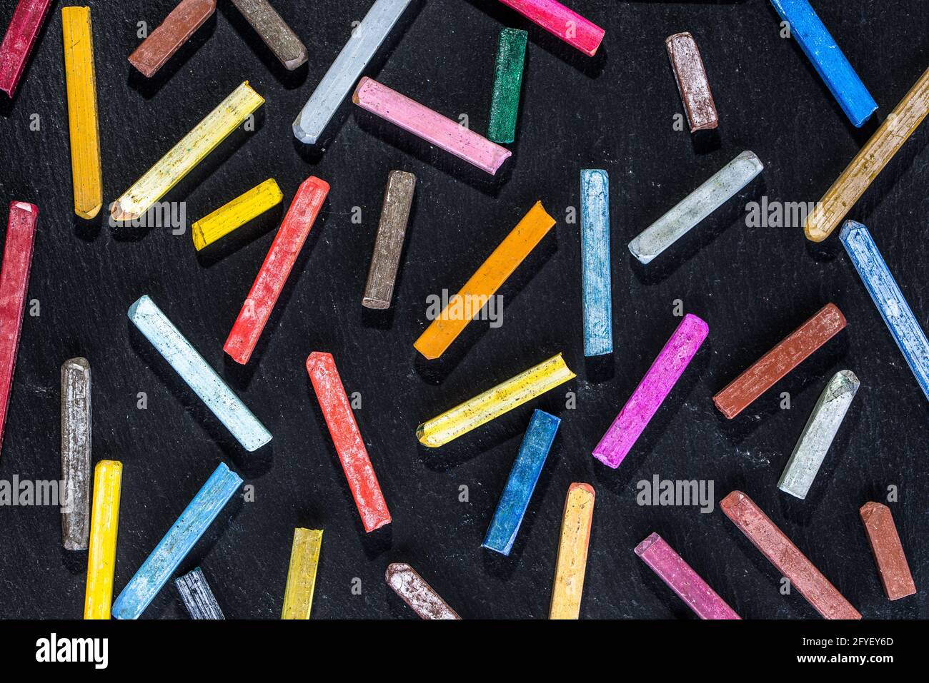 Colorful wallpaper with chalks, pattern on black background of ...
