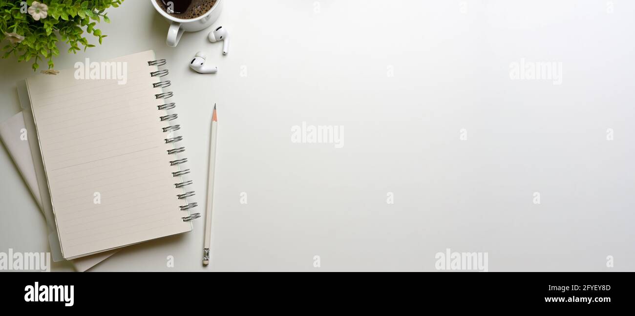 Top view of minimal study table with copy space, notebooks, pencil and ...