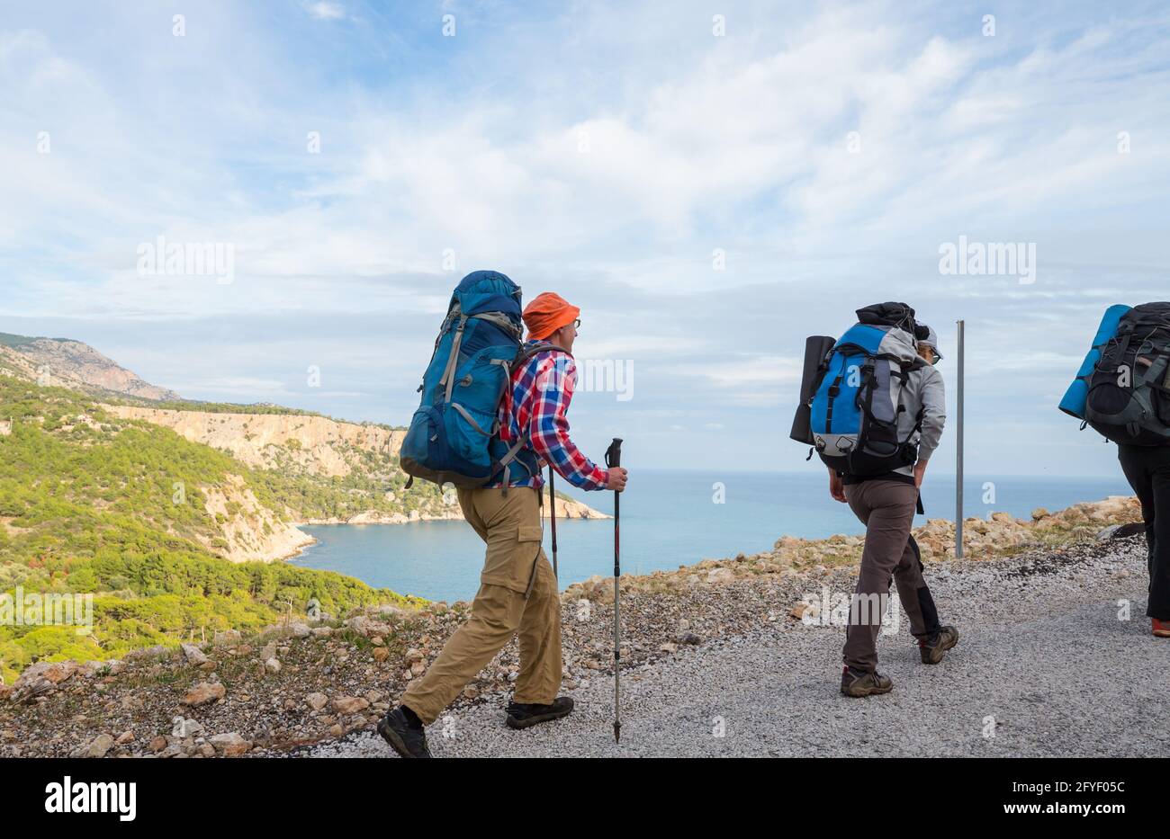Group of backpackers hiking in mountains outdoor active lifestyle ...