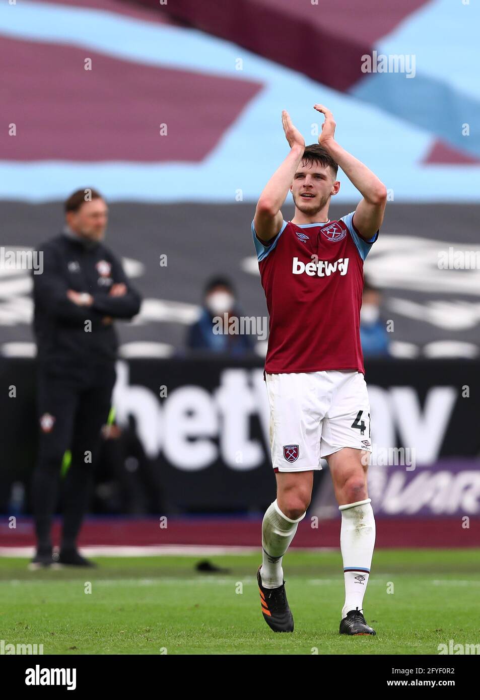 Declan Rice of West Ham United applauds the fans as his is substituted ...