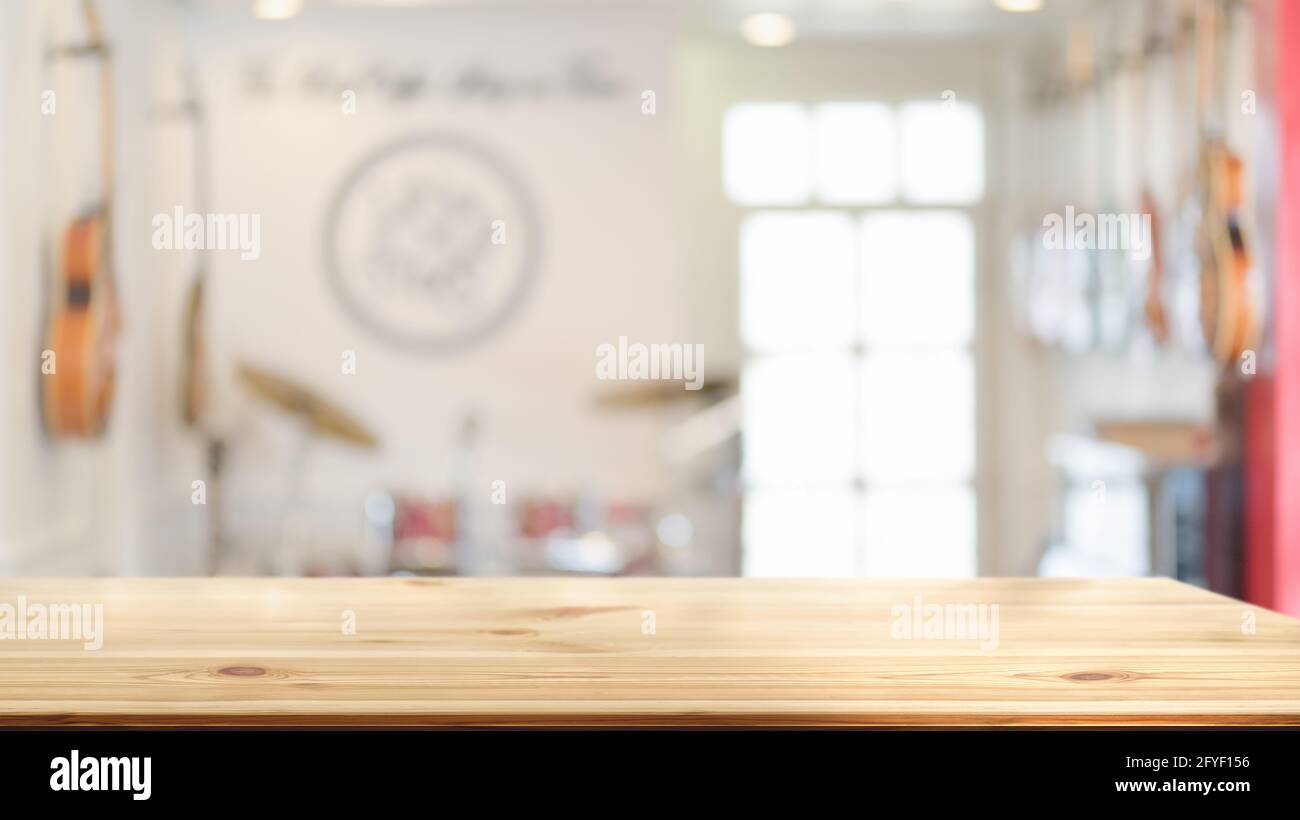 Wooden table with copy space and blurred background with music ...
