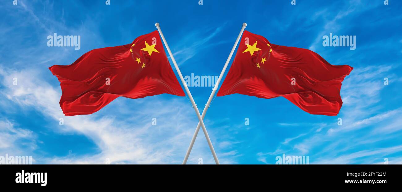 flags of China and china waving in the wind on flagpoles against sky ...