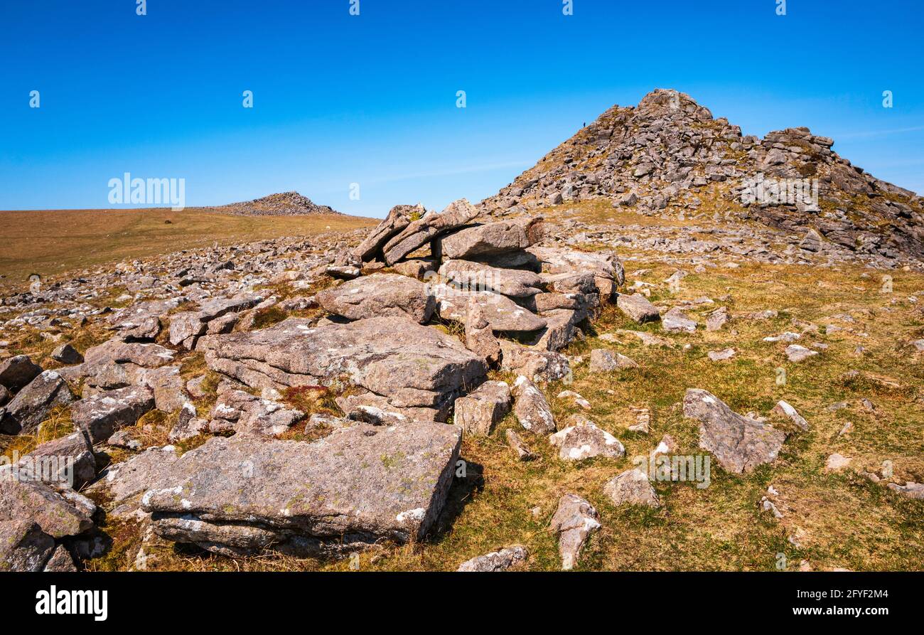 Leather Tor, with a climber admiring the view, seen from Lower Leather ...
