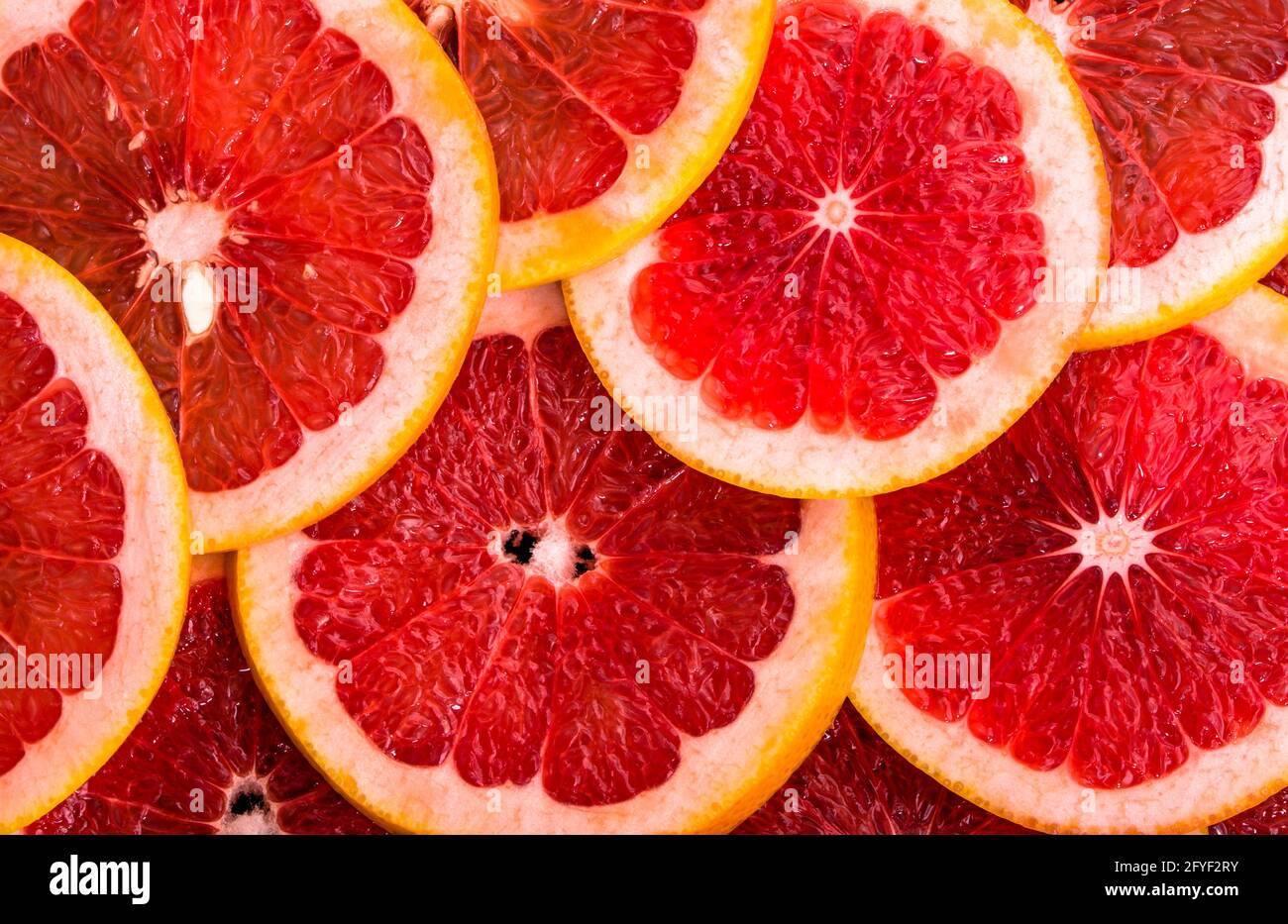 Texture of grapefruit slices, close up, overhead, citrus backgrounds Stock Photo - Alamy