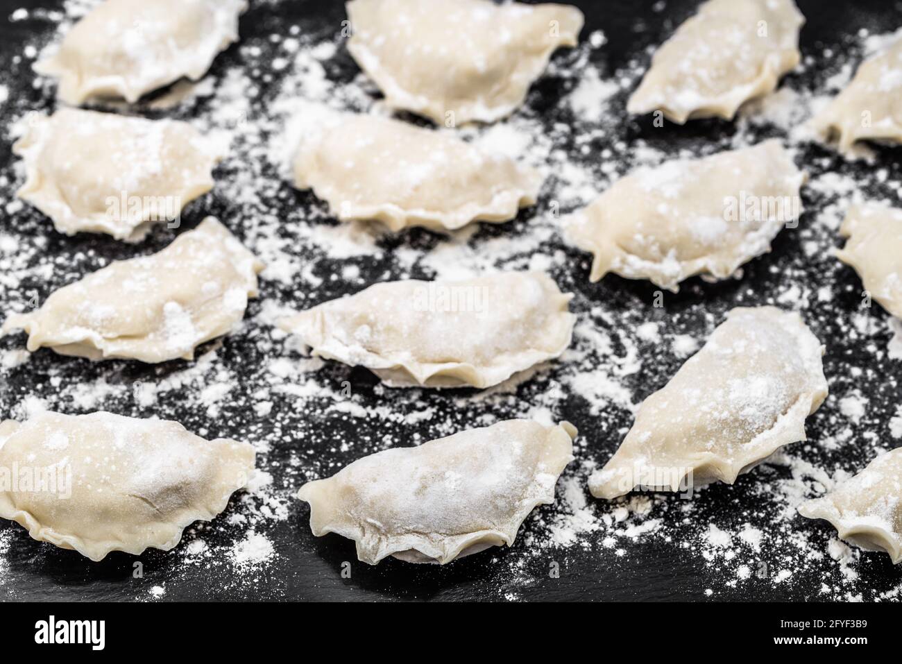 Raw dumplings background, cooking homemade Stock Photo - Alamy