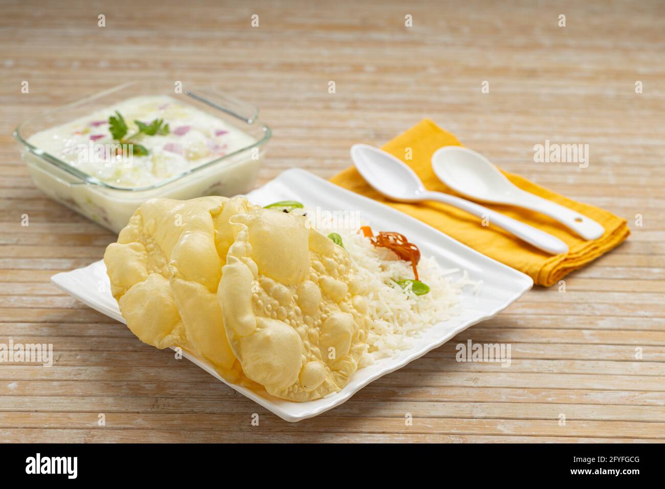 Kerala Papadum or plain pappadom or Appalam ,arranged in a wooden board ...