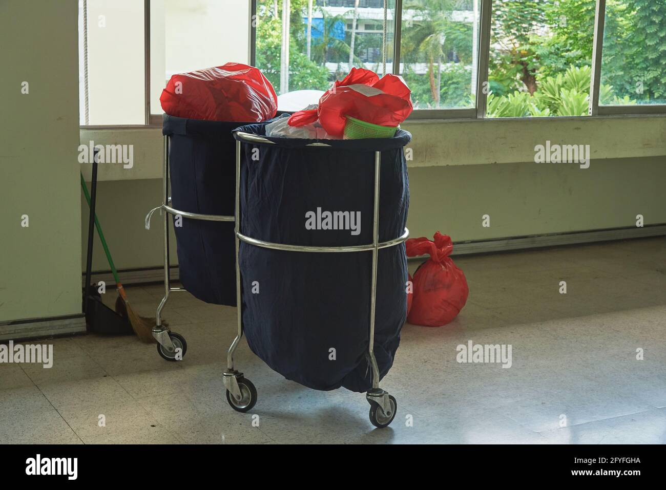 Garbages bins and broom with dust pan on the hospital floor Stock Photo ...