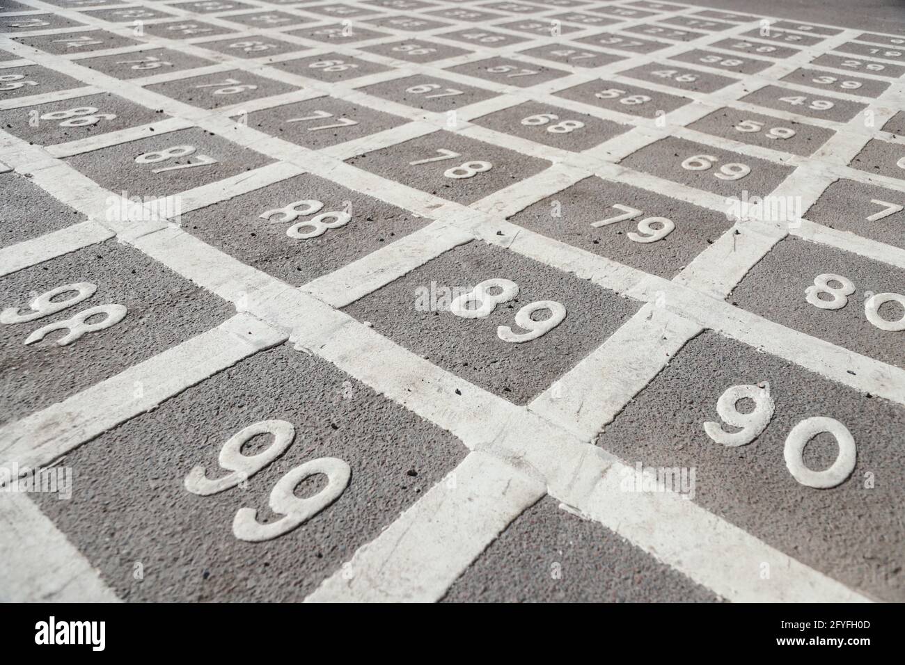 A game with numbers in the ground on a schoolyard, Linköping, Sweden ...