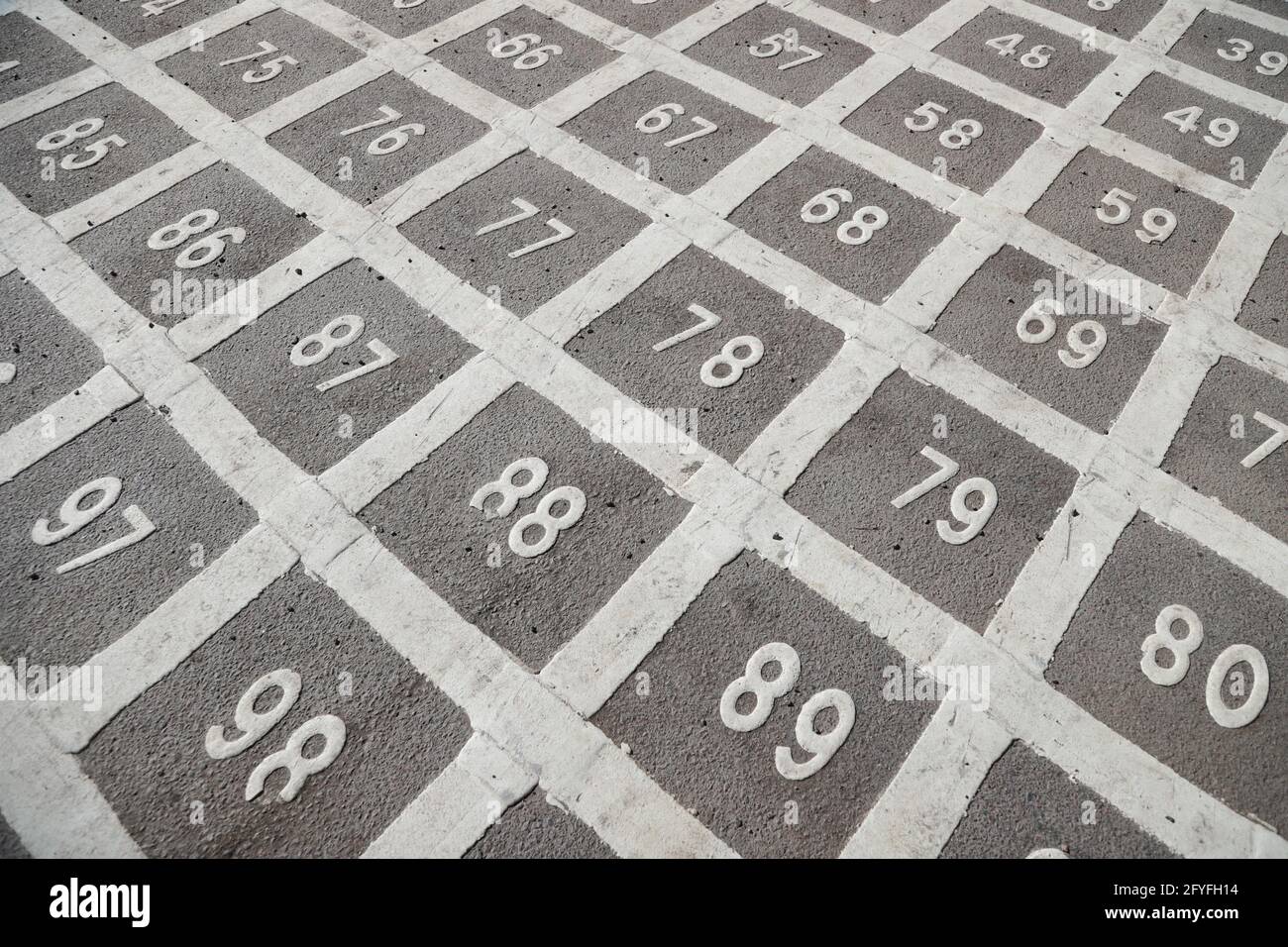 A game with numbers in the ground on a schoolyard, Linköping, Sweden ...