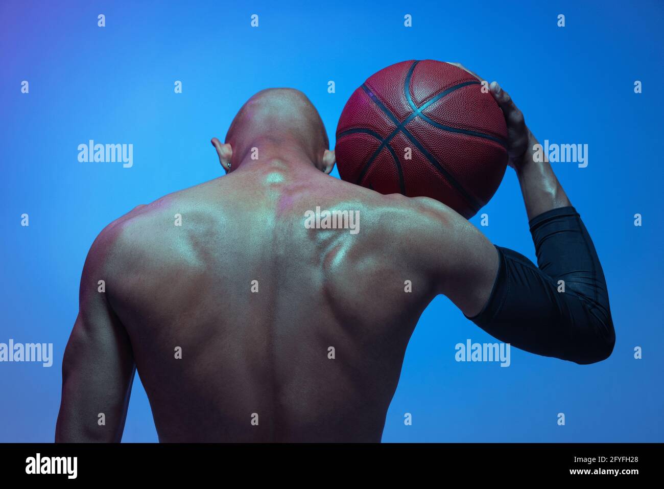 Close-up back view of athletic african-american male basketball player ...