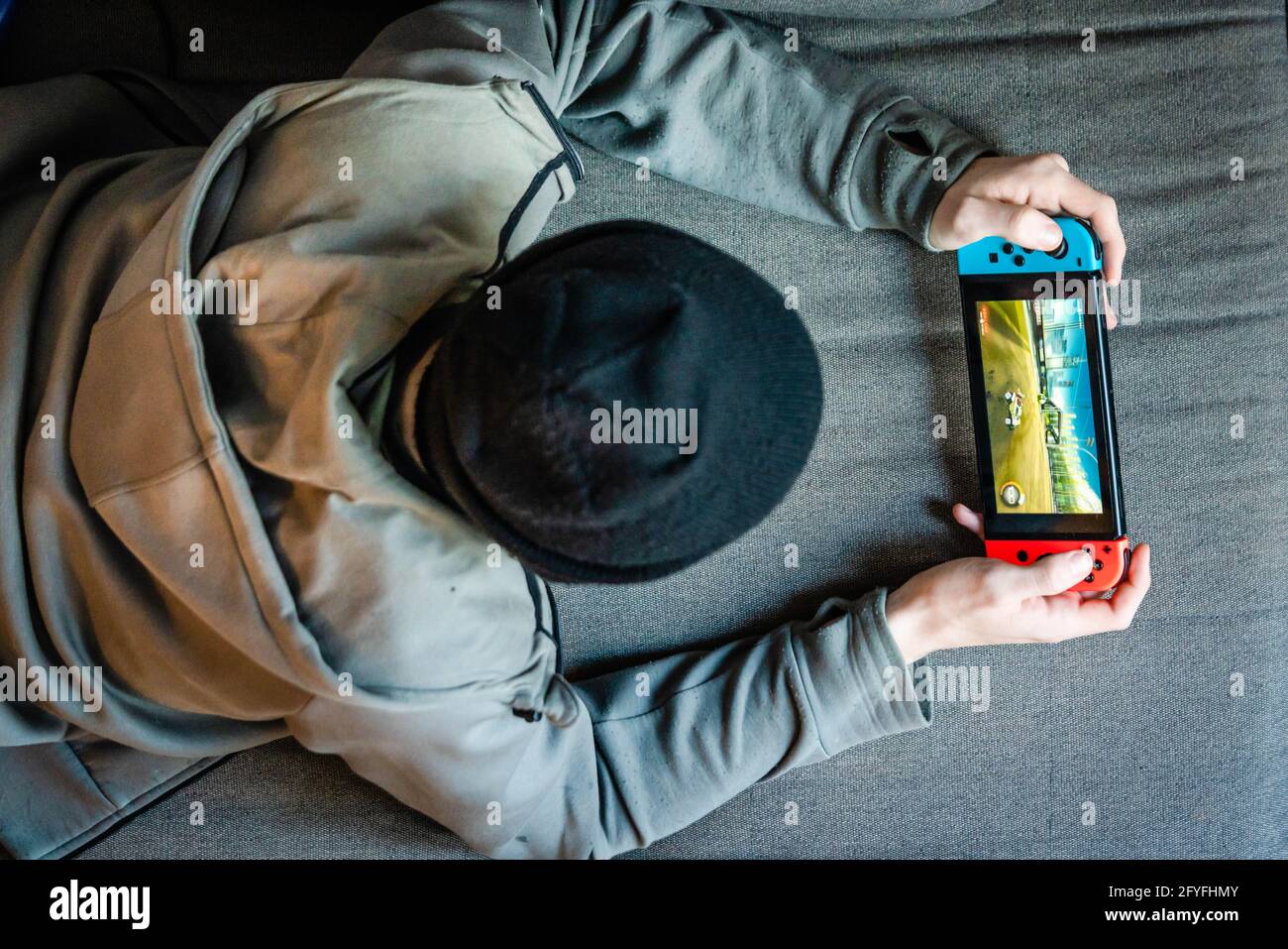 Young man playing a video game on a Switch, France Stock Photo - Alamy