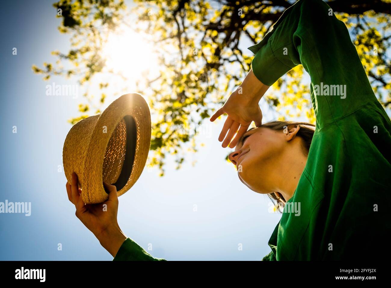 Woman dazzled sun hi-res stock photography and images - Alamy