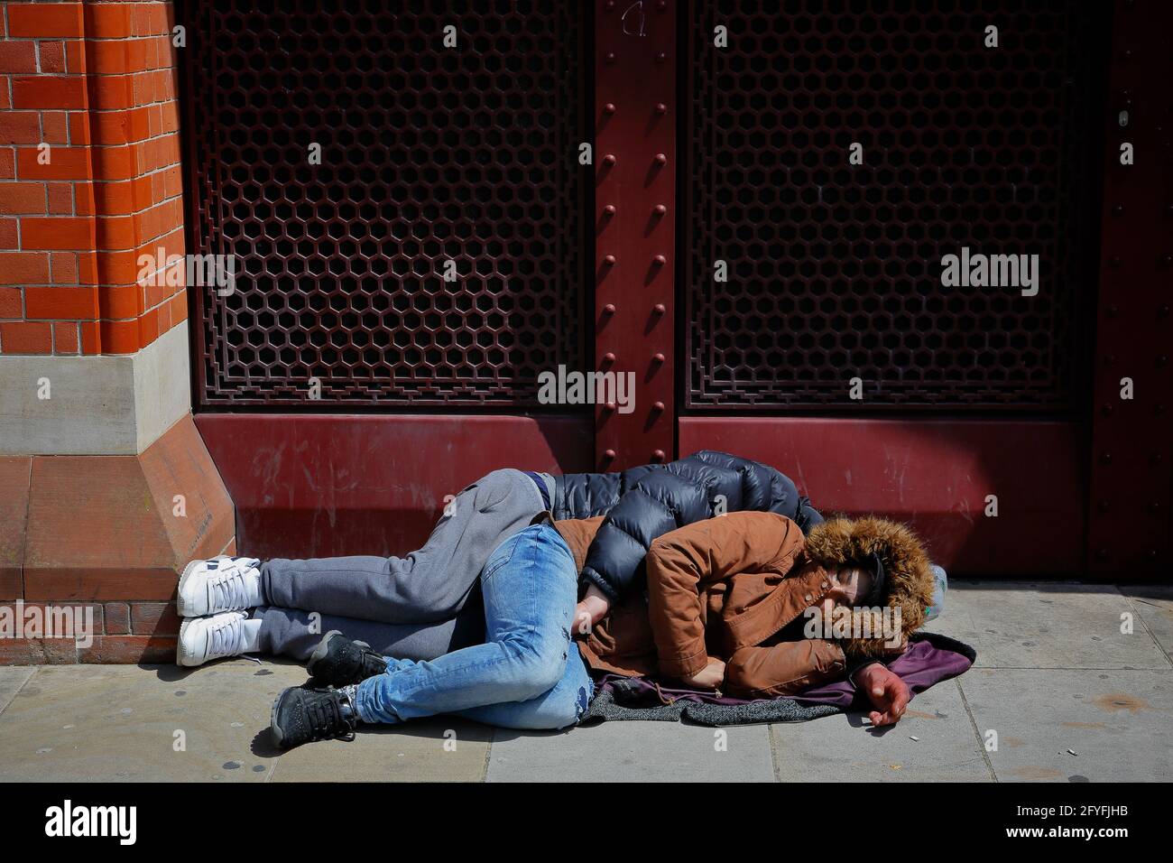 London (UK), 27 May 2021: A (homeless) couple sleep entwined on the ...