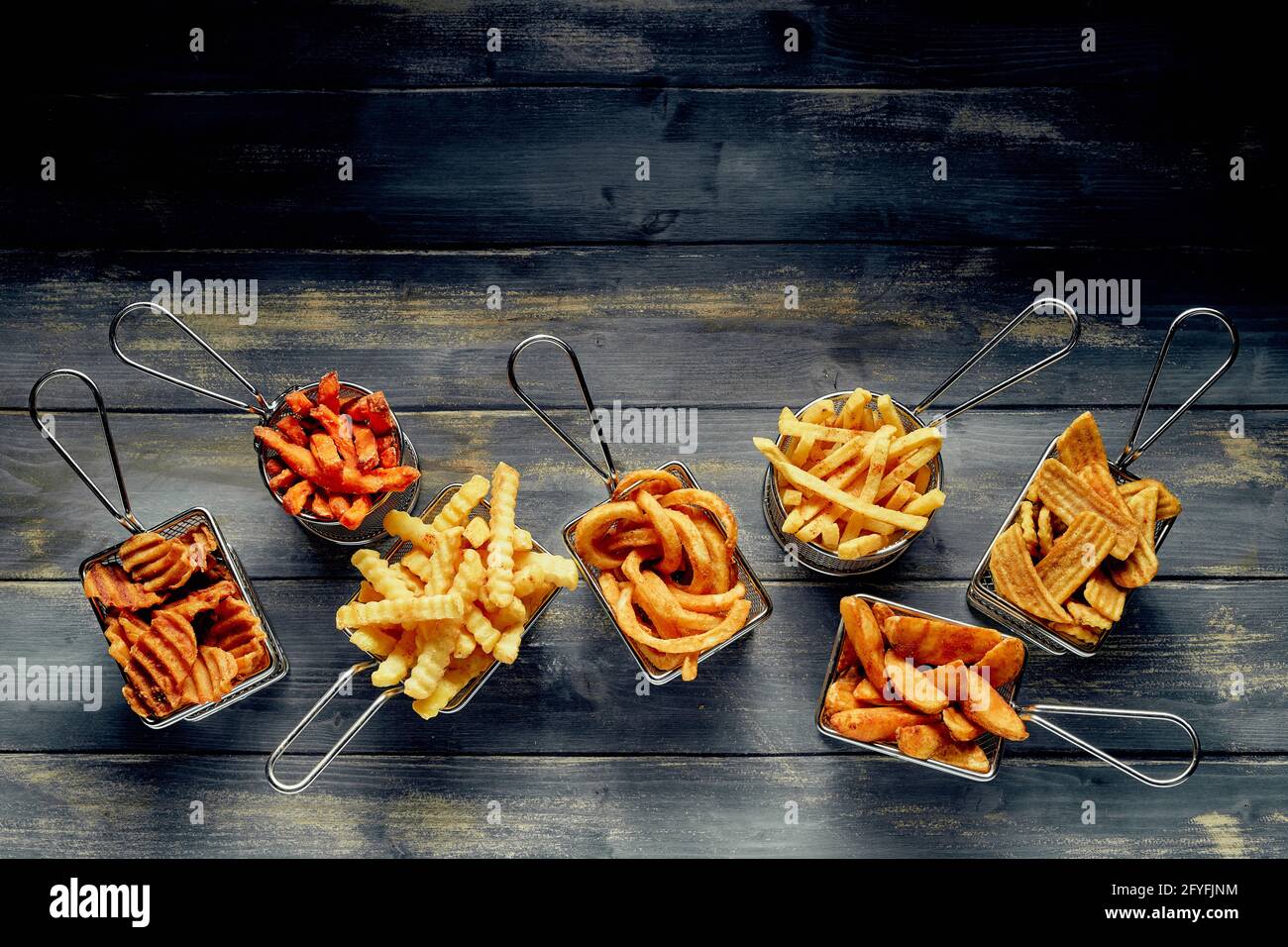 Different types of French fries including wedges and sweet potatoes ...