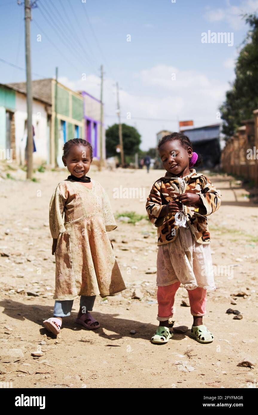 Ethiopian children in the street of Hawzien village, two little girl ...