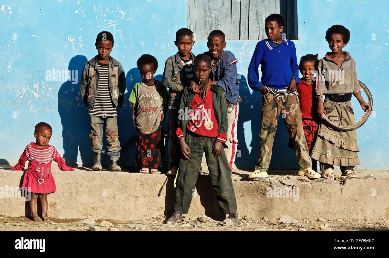Ethiopian children group in front of a colorful house in Atsbi village ...