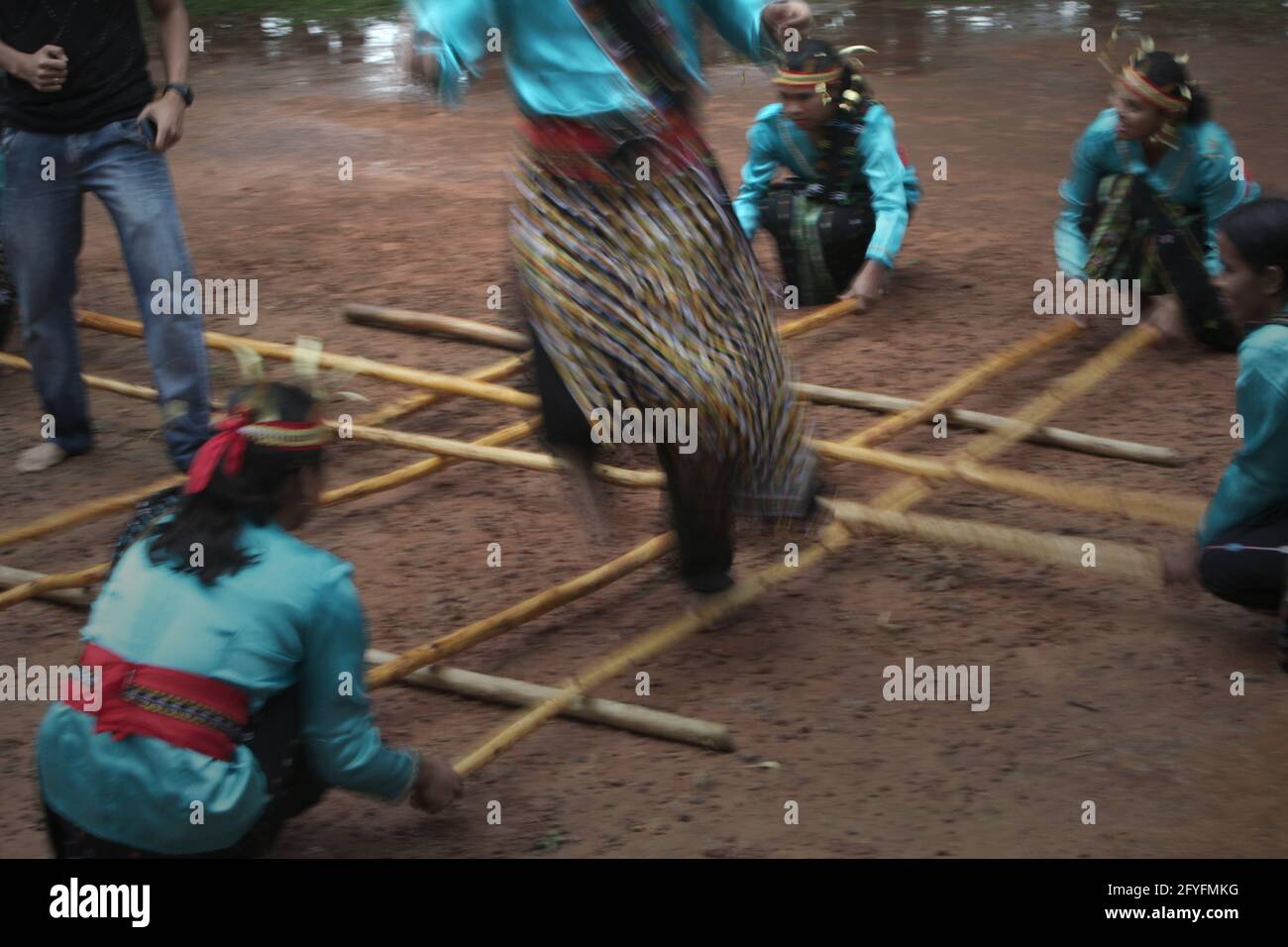 Women playing a traditional game after a show of "caci" (Flores Island ...