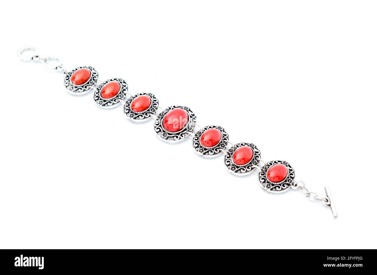 Bracelet with red stones isolated on white Stock Photo - Alamy