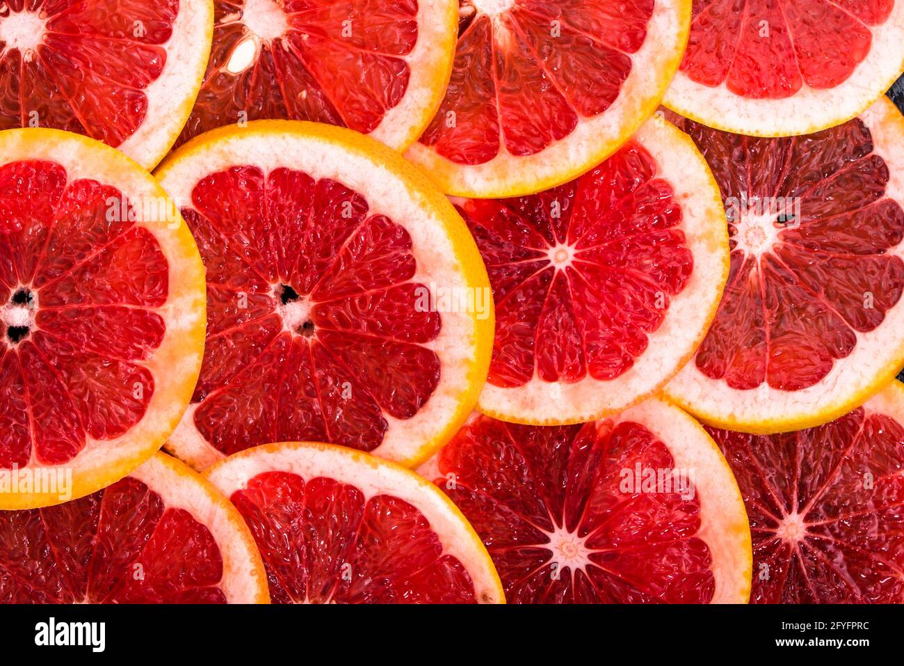 Slices of grapefruits texture, natural backgrounds of citrus fruits ...
