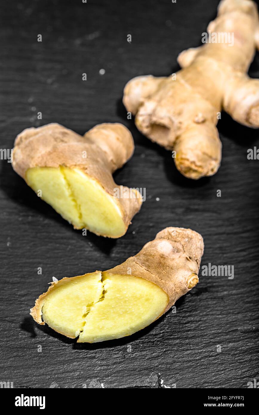 Cut ginger root on dark background, spice in cuisine for healthy ...
