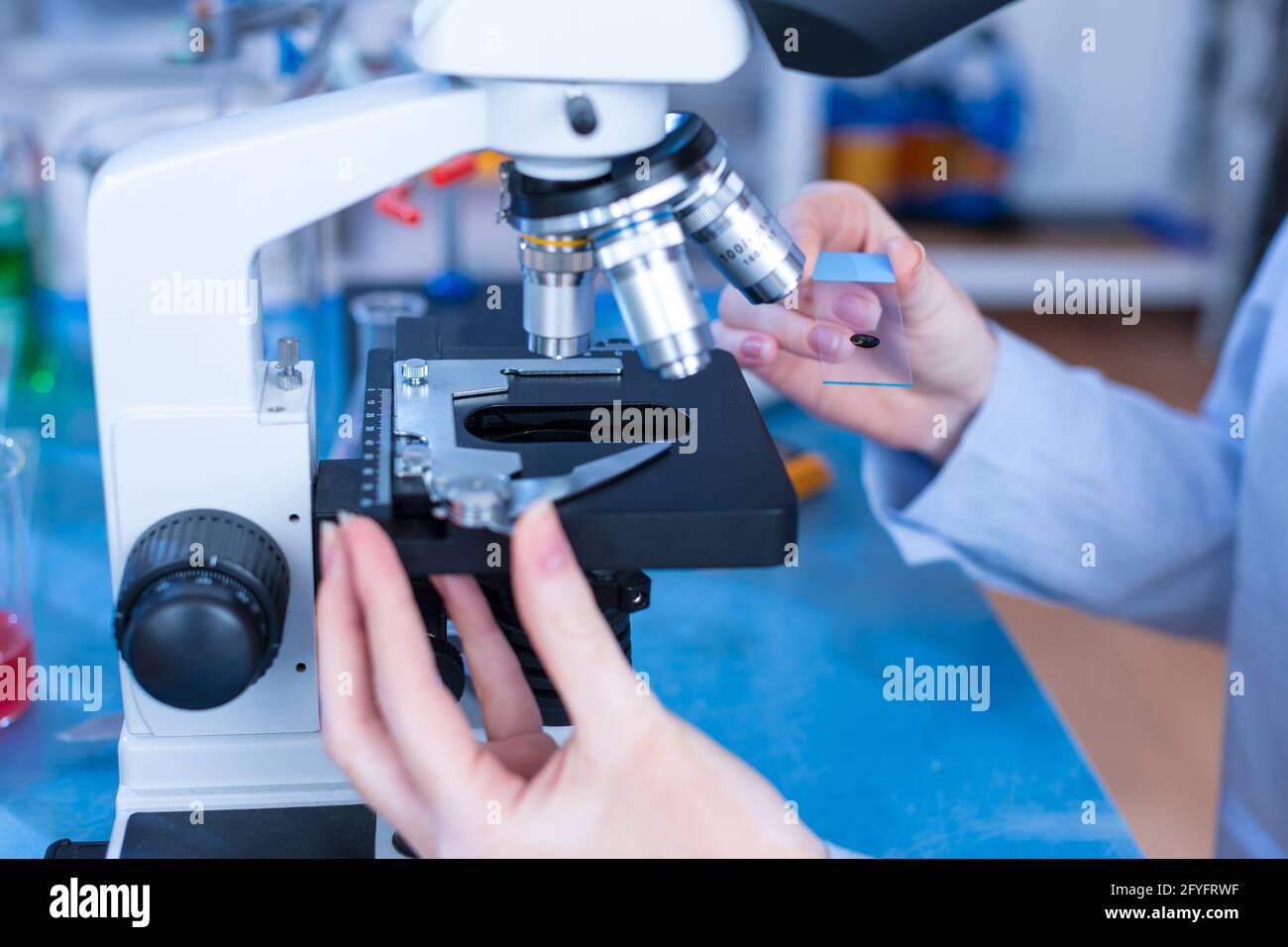 Girl laboratory Assistant works with an antiviral drug in a ...