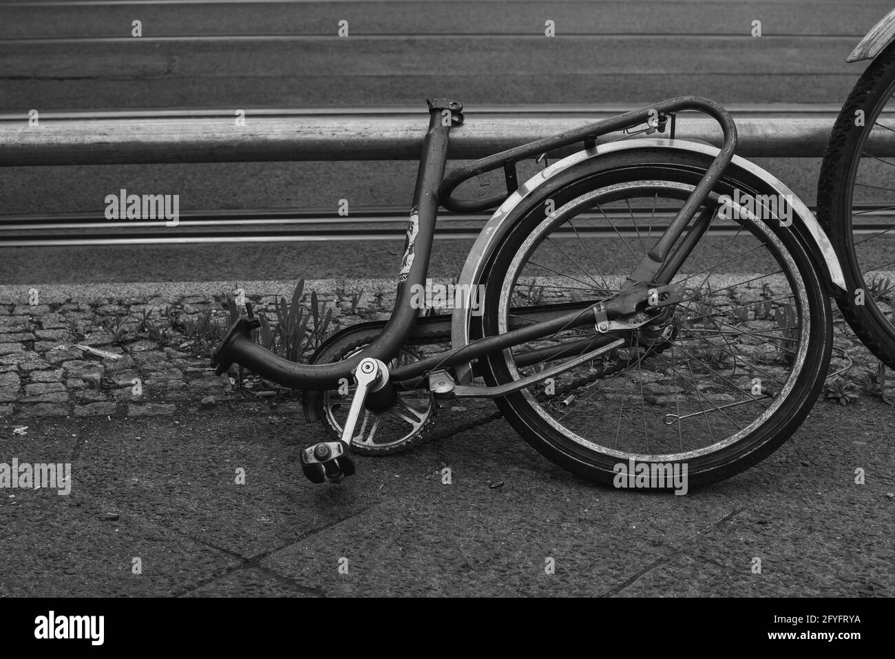 An old junk bike attached to a railing, old junk bike, a half bike, black and white photo Stock ...