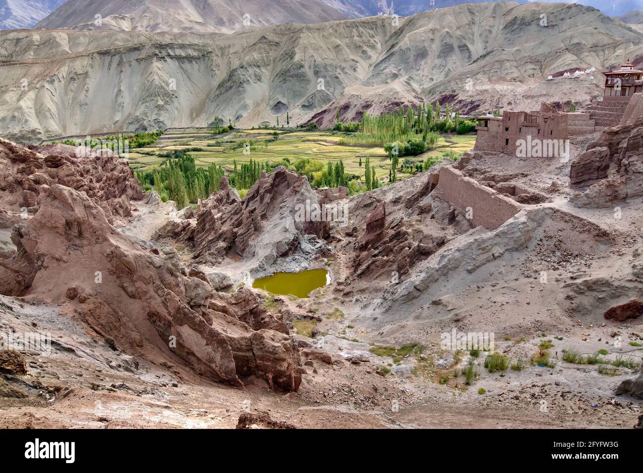 Ruins at Basgo Monastery with stones , rocks and a pond, natural view ...