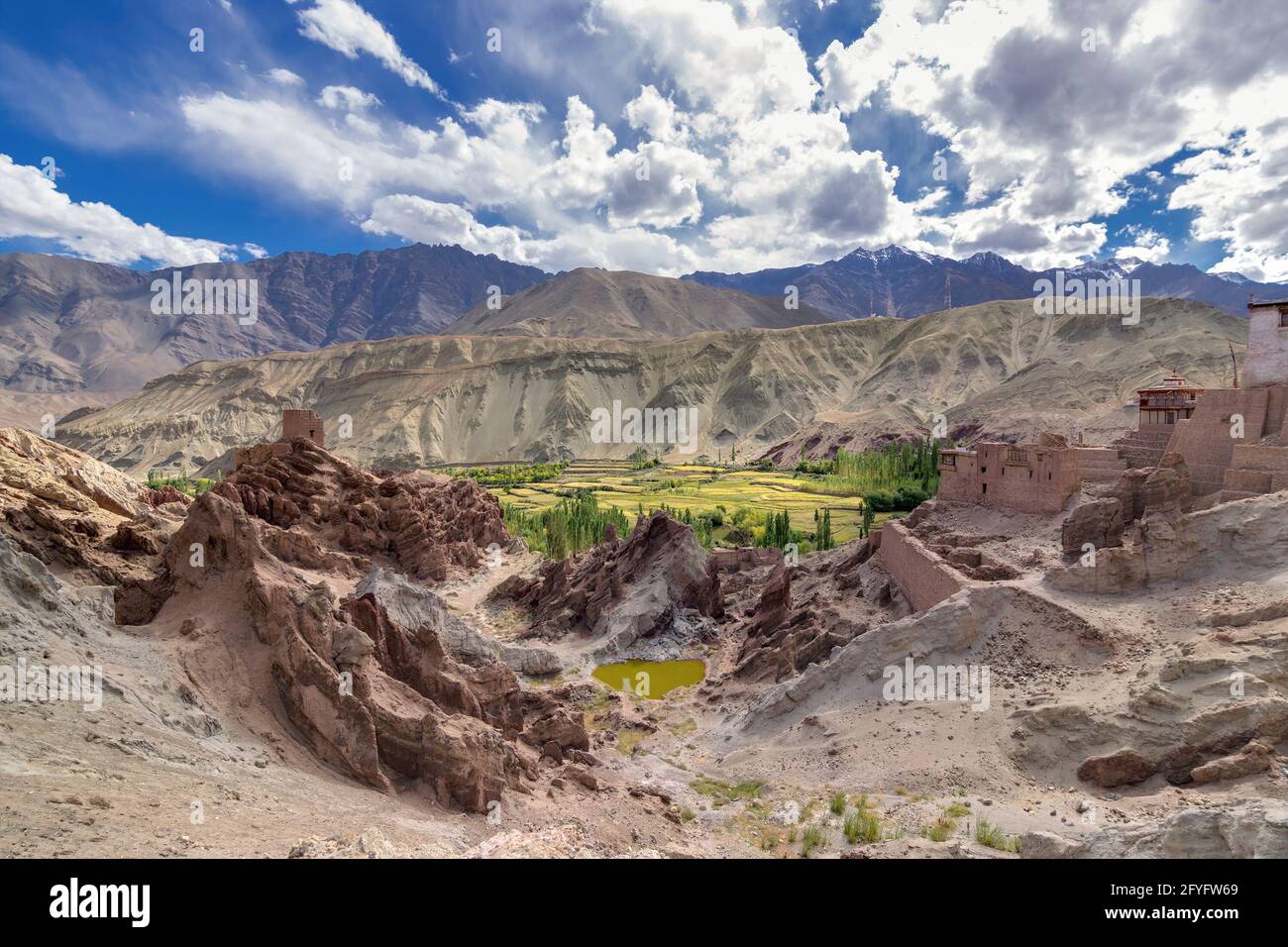 Ruins at Basgo Monastery with stones , rocks and a pond, natural view ...