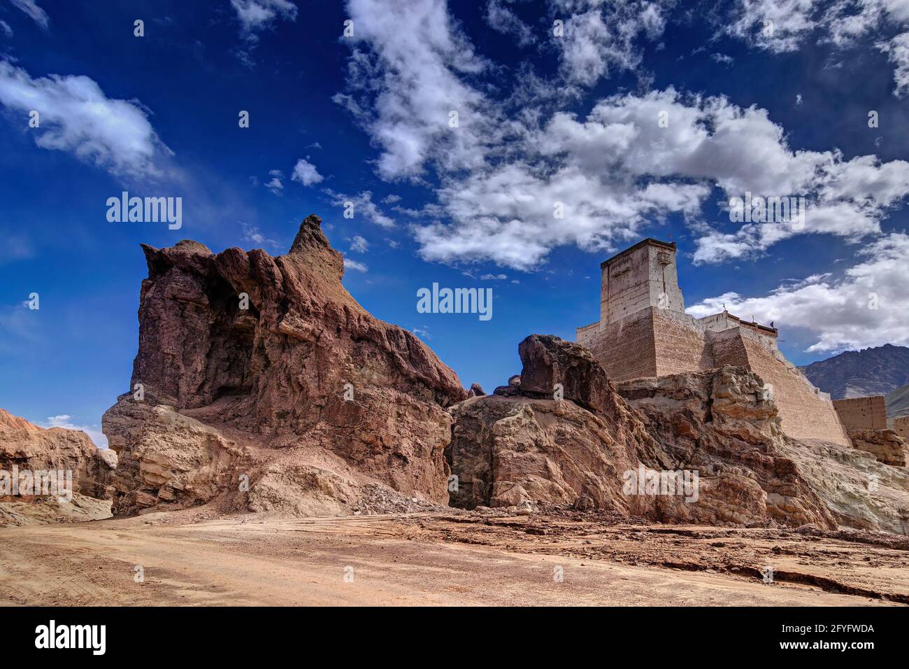 Ruins and Basgo Monastery surrounded with stones and rocks , Blue sky ...