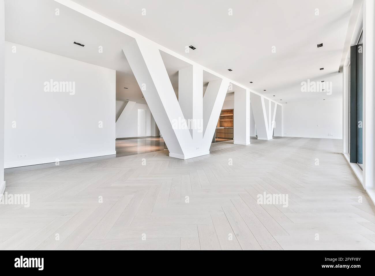 Wall windows with triangle pillar viewing cityscape from luxury ...