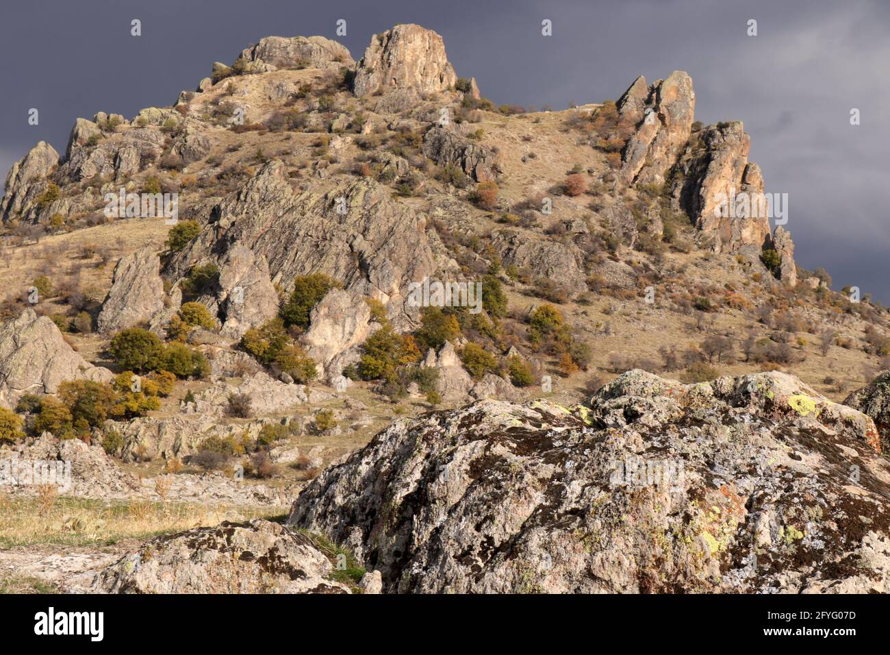 rocky peak and dramatic sky scenery Stock Photo - Alamy