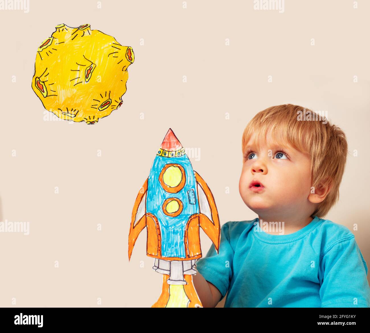 Cute young toddler play rocket land on a planet Stock Photo - Alamy