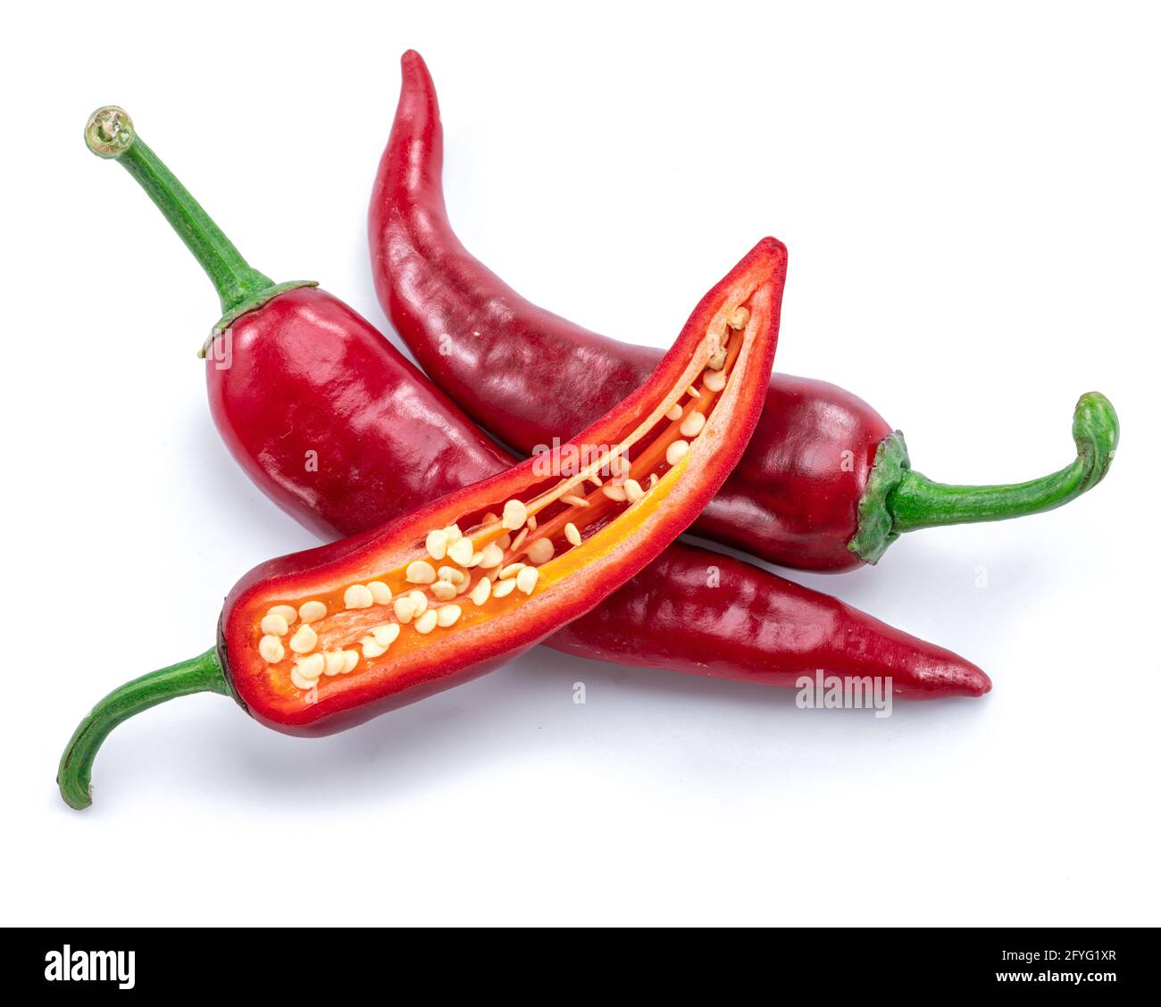 Fresh red chilli peppers and cross section of chilli pepper with seeds ...