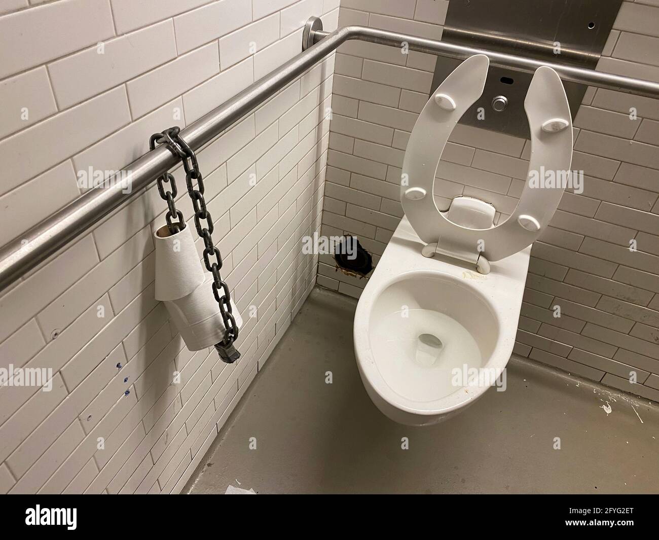 New York, NY, USA - May 28, 2021: Toilet paper chained to steel bar in ...