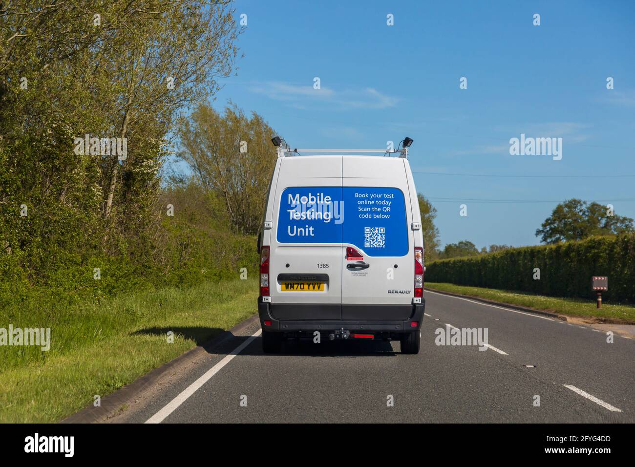 Mobile Testing Unit Renault Master van driving along road in Dorset UK ...