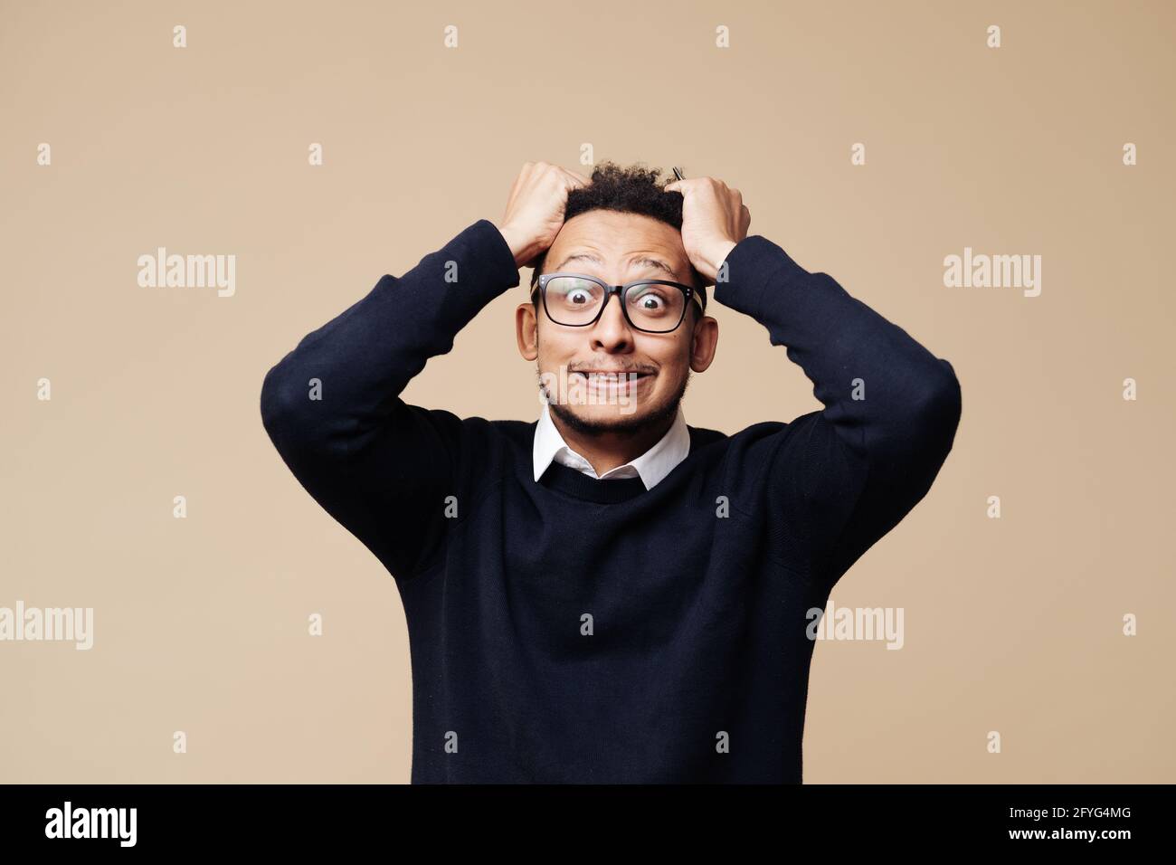 Angry man. Afro man over beige background. Face expression. Crazy man ...