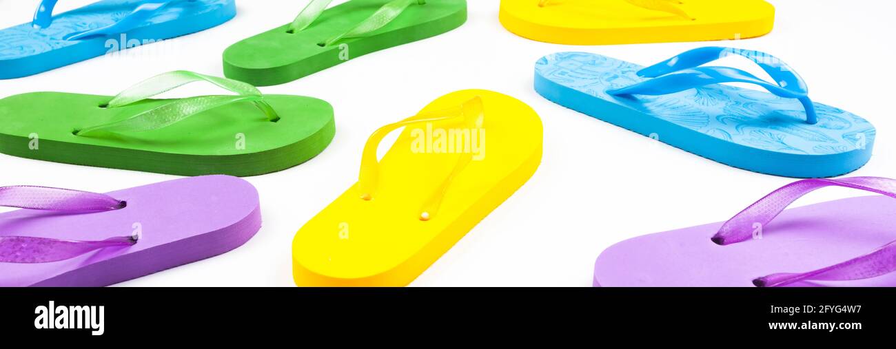 multi-colored rubber beach flip flops on a white background Stock Photo ...