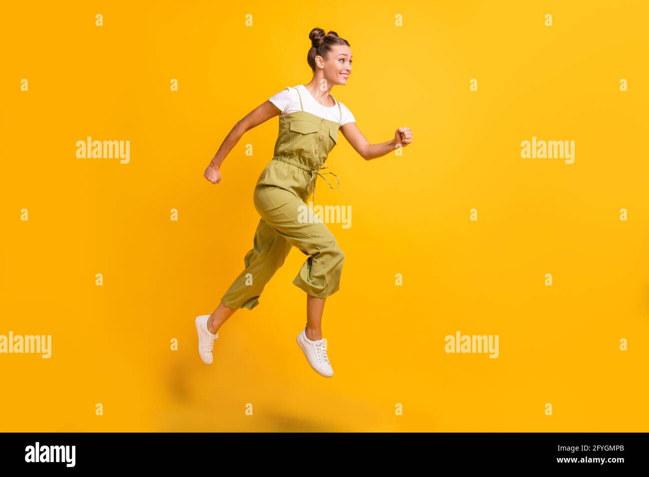 Full length body size view of pretty cheerful active girl jumping ...