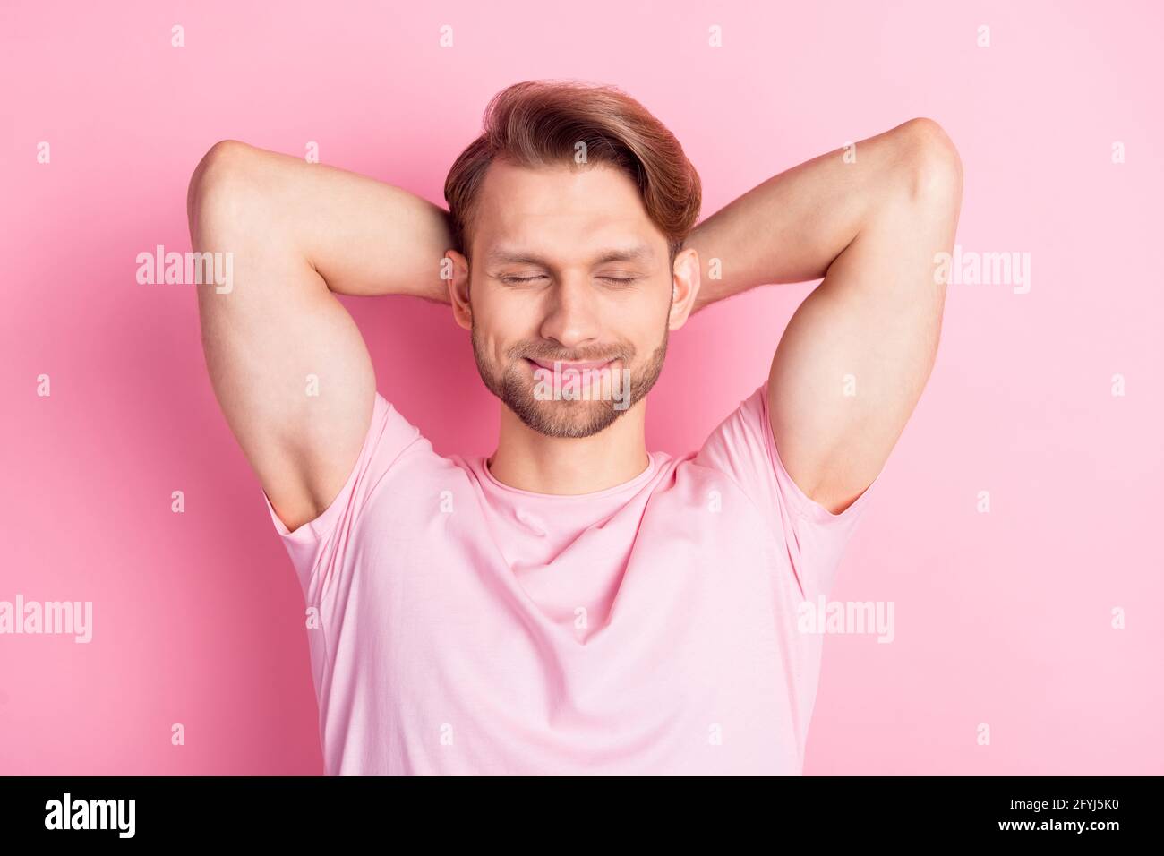 Male model arms behind head hi-res stock photography and images - Alamy