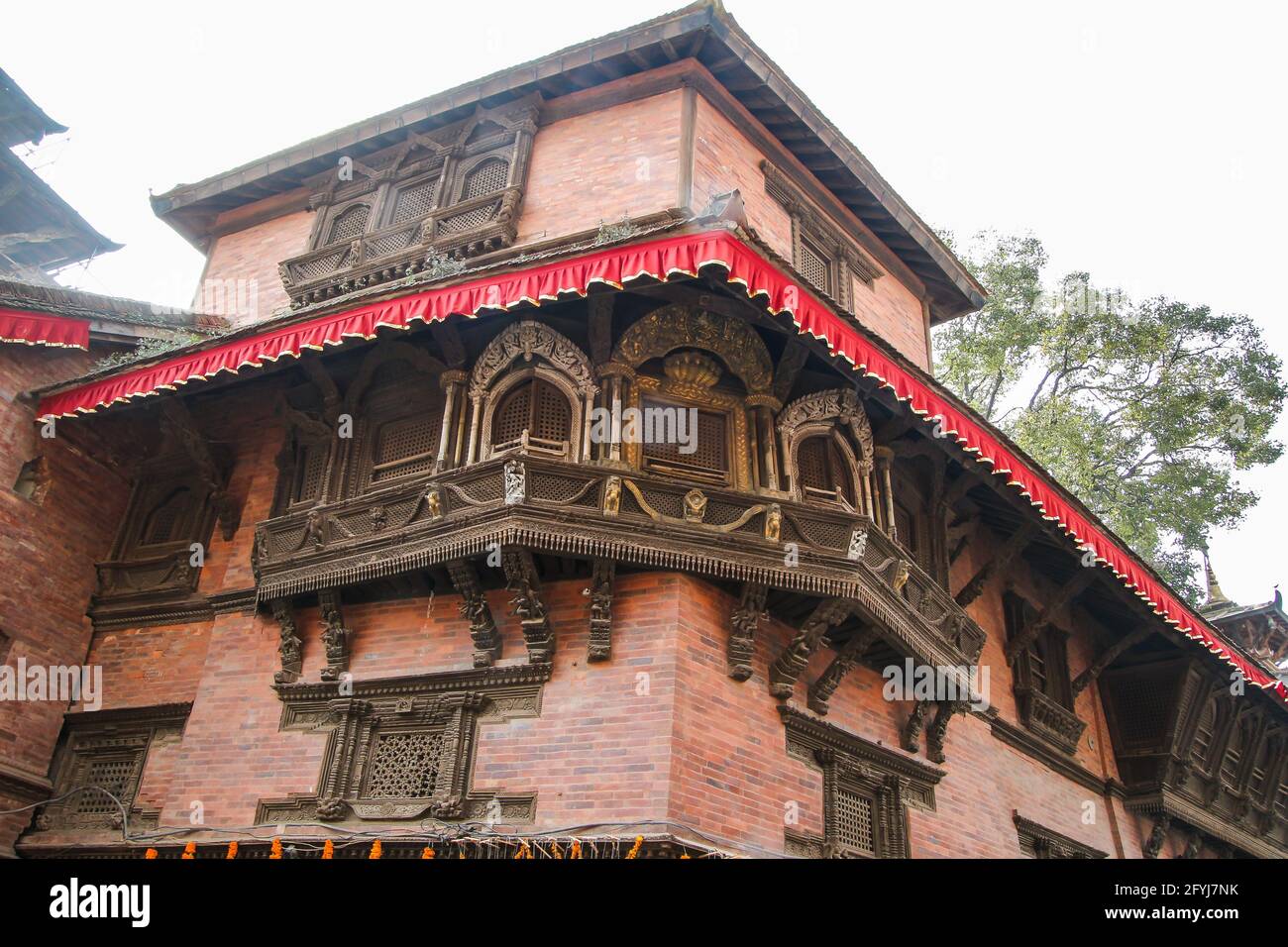 Ornate, richly carved balcony of old house in Durbar Square, Kathmandu ...