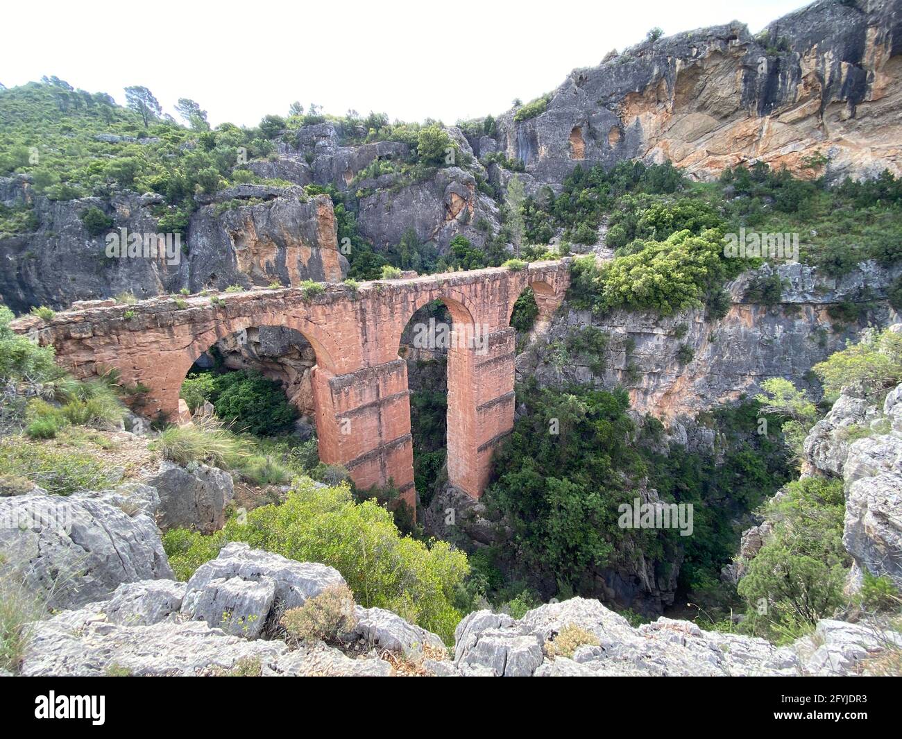 Ancient roman empire aqueduct Peña Cortada in Calles, Valencia, Spain ...