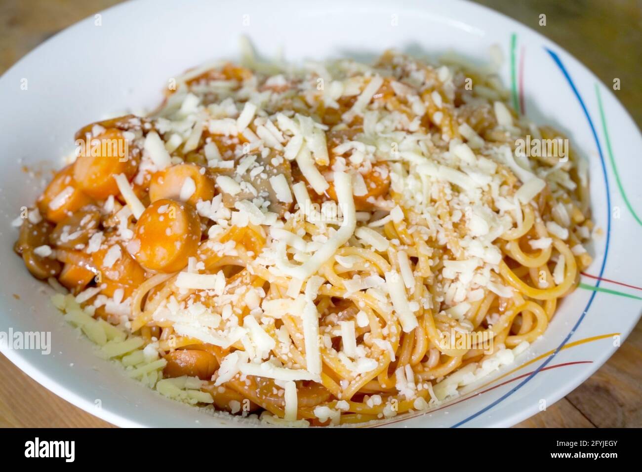 Lots of mozzarella cheese on tomato sausage pasta. macaroni, italy ...