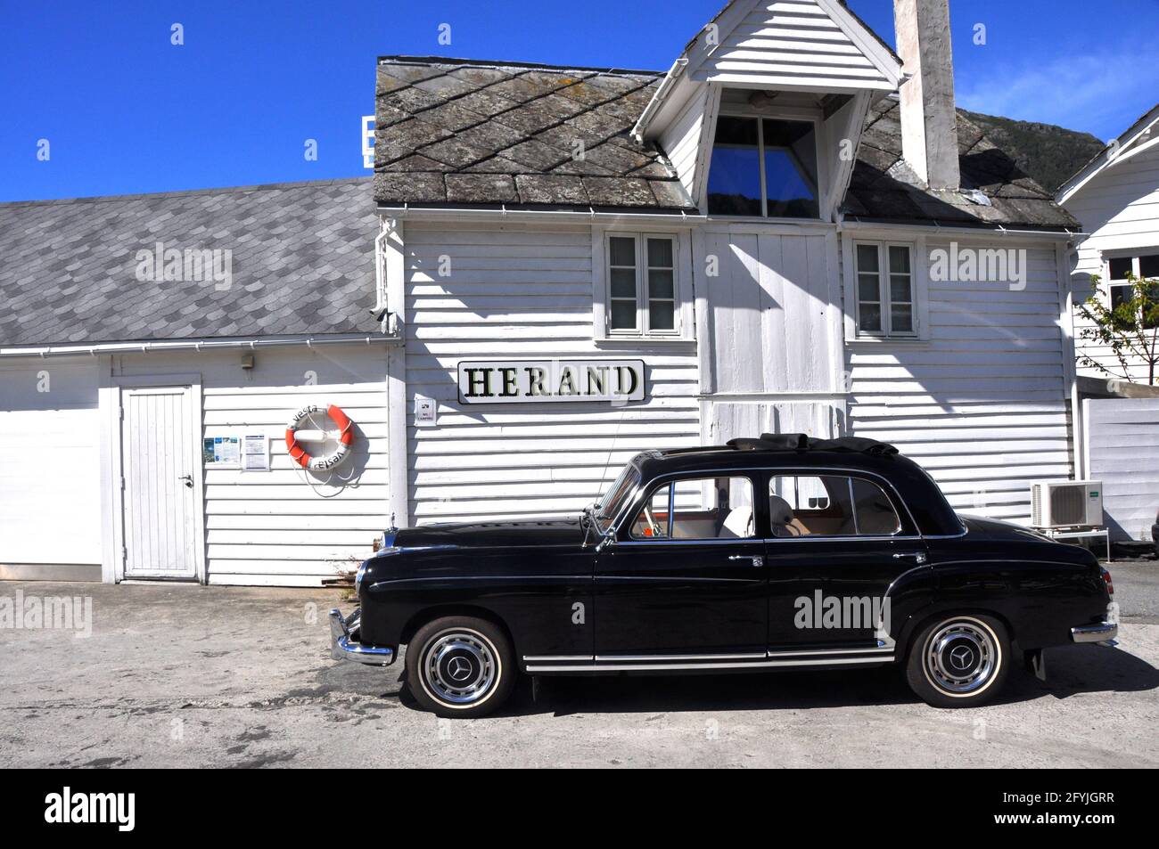HERAND, NORWAY - Jul 19, 2014: Old black classic car in front of white ...