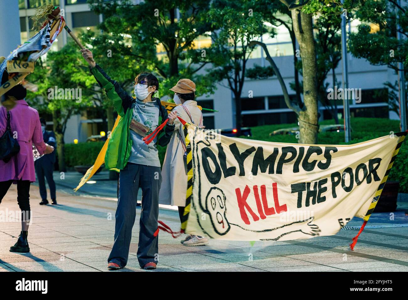29 May 2021: Protester waves ribbon with multiple languages written ...