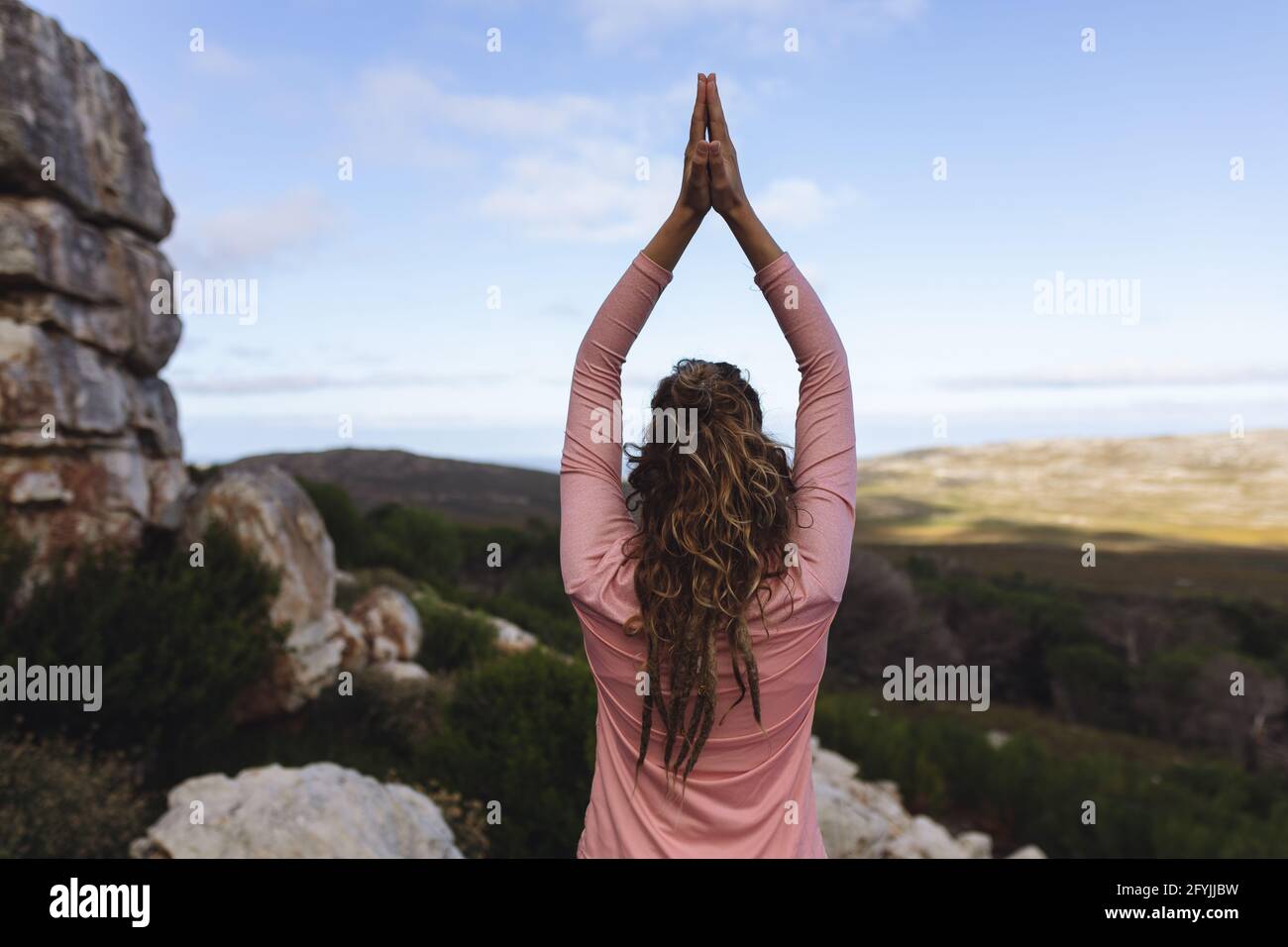 Woman arms raised rear view sky hi-res stock photography and images - Alamy