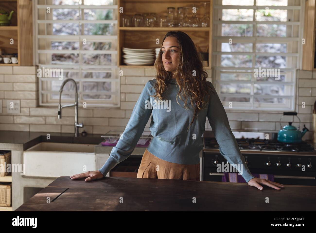 Standing behind the counter hi-res stock photography and images - Alamy