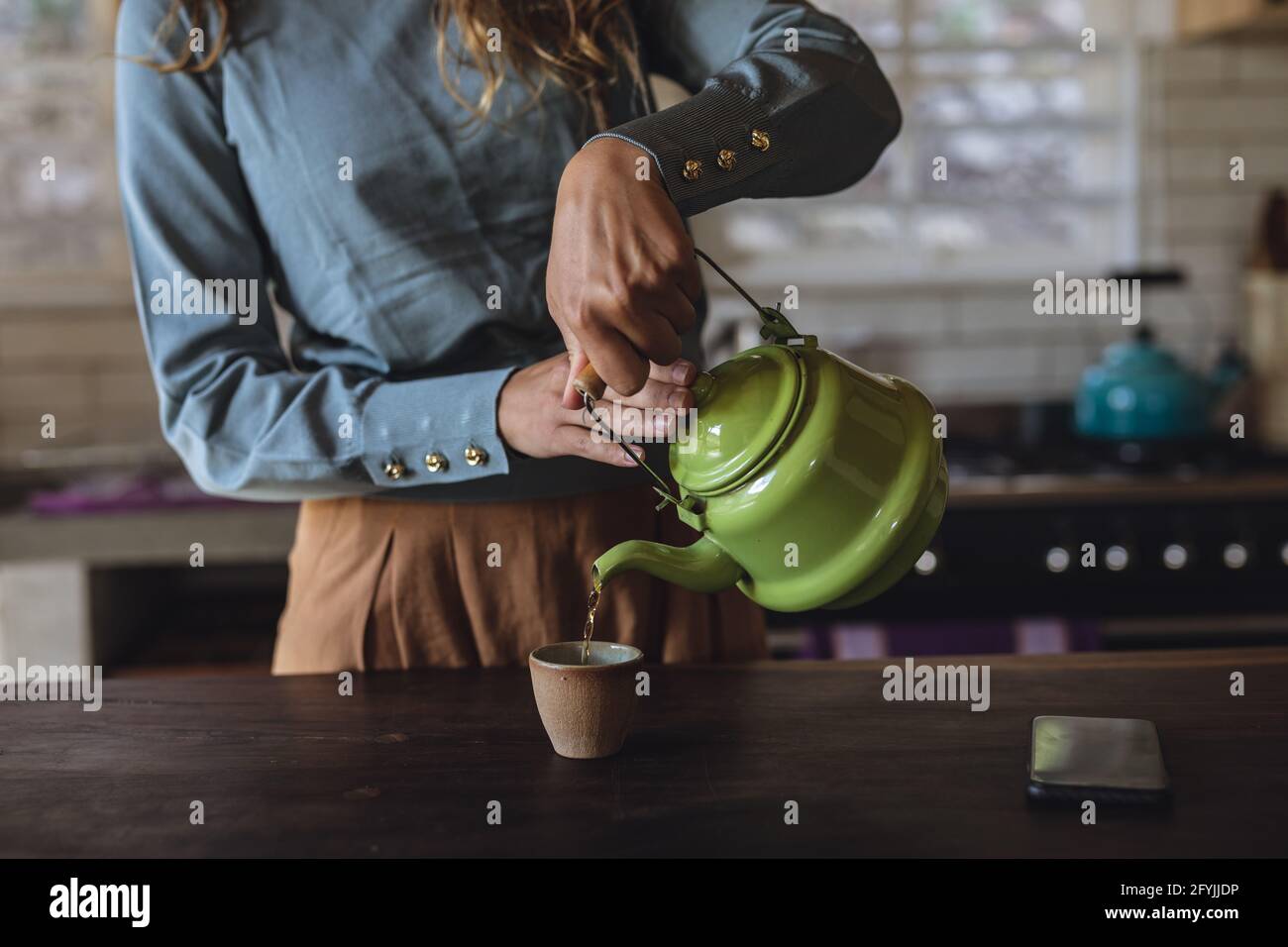 Woman kettle tea hi-res stock photography and images - Alamy