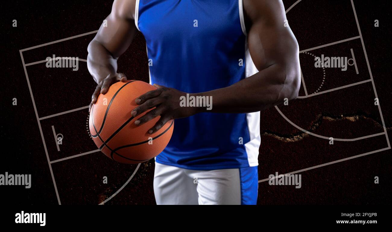 Composition of african american male basketball player holding ball ...