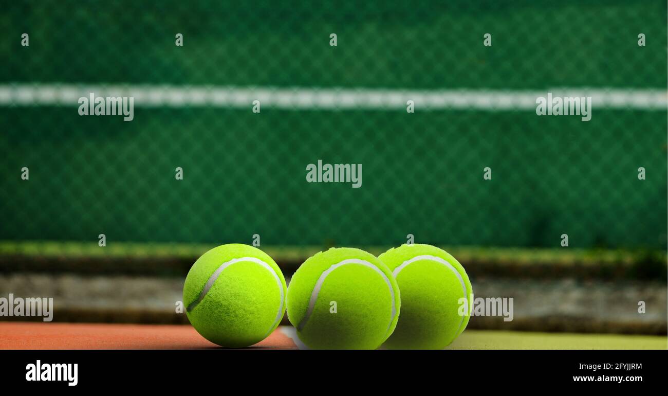 Composition of three tennis balls on tennis court with copy space Stock ...
