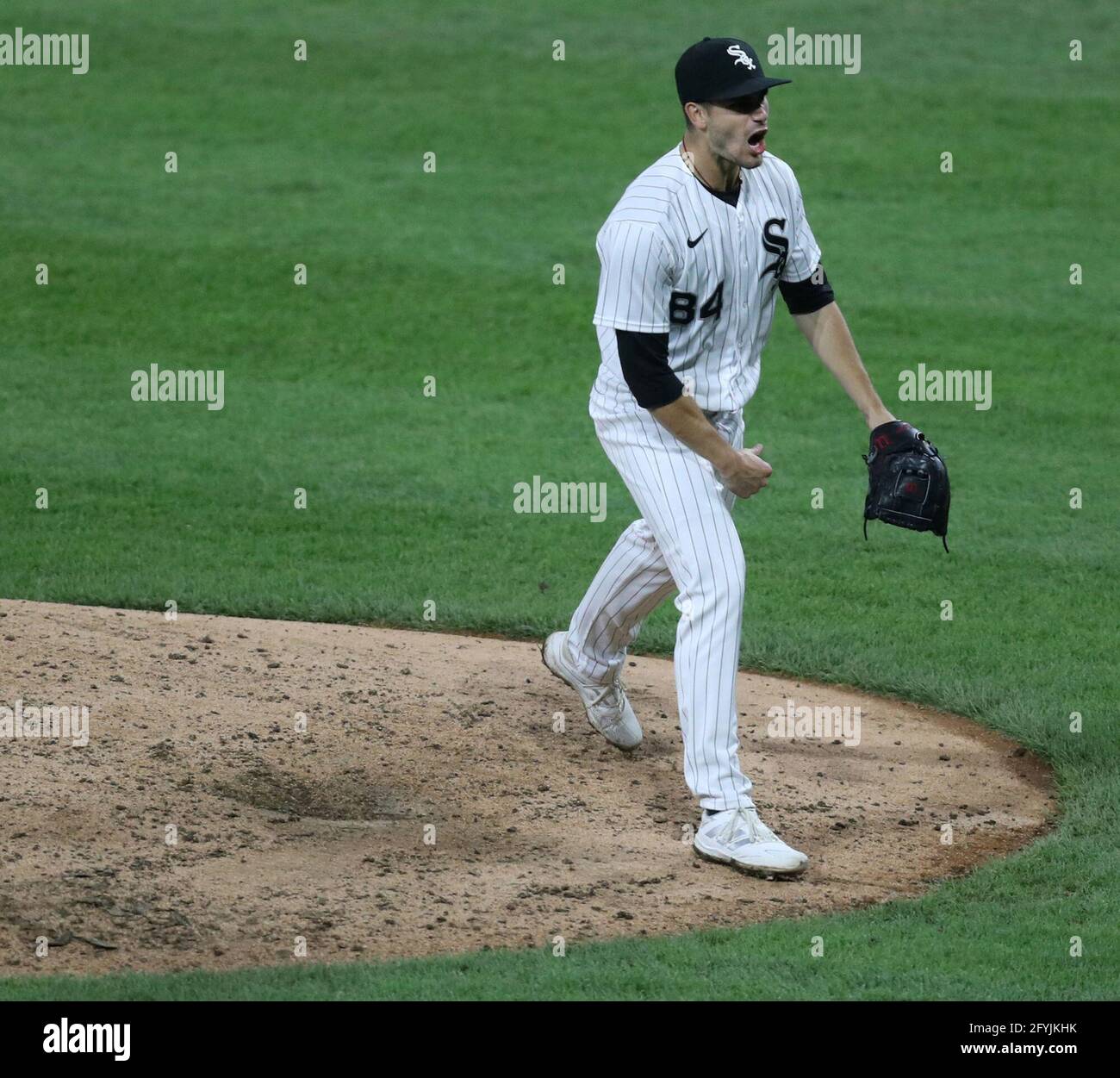 Chicago White Sox starting pitcher Dylan Cease reacts after striking ...